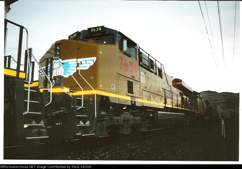 UP 7639 reflects the flash of its reflective paint in the early morning rays
